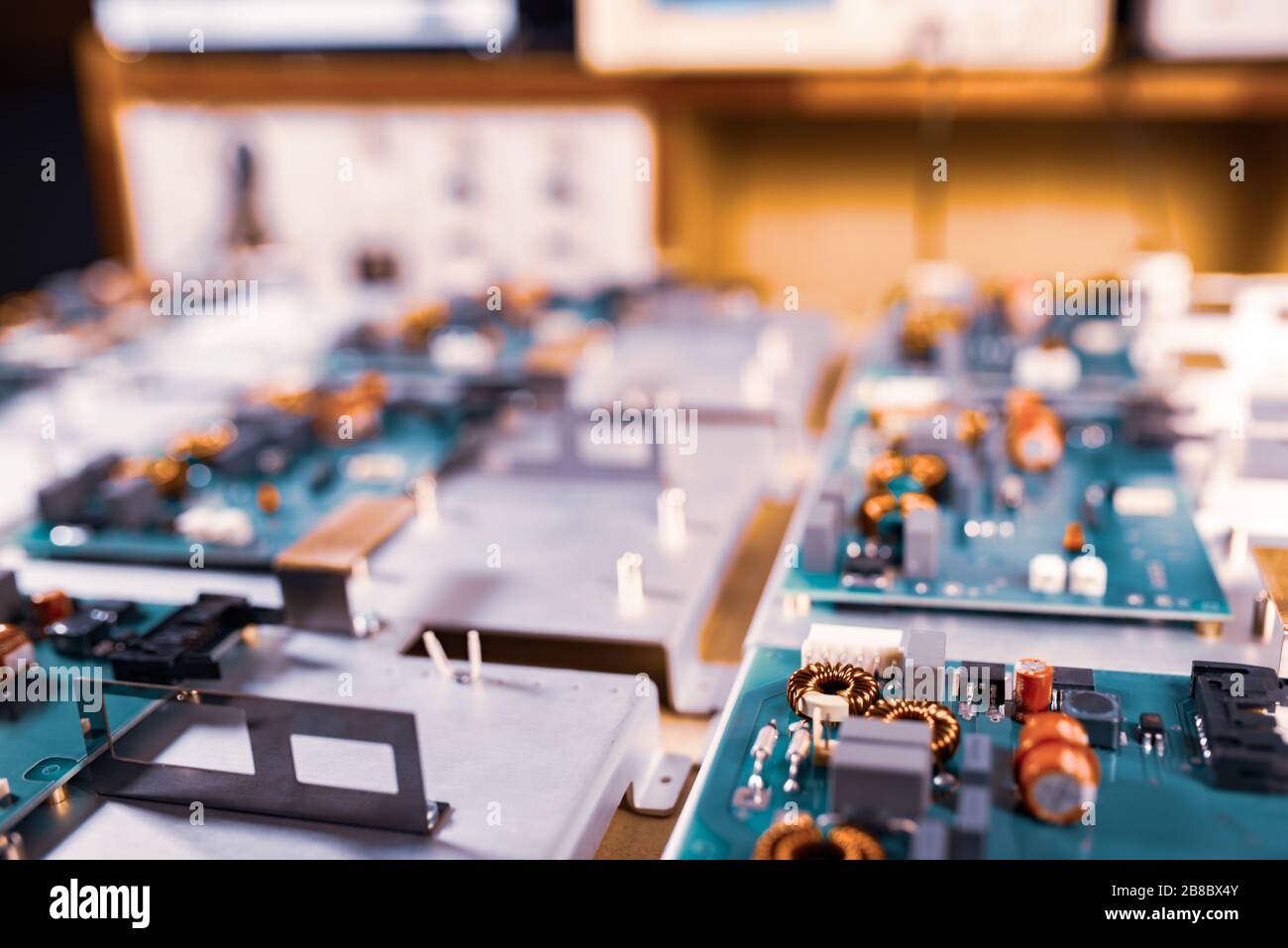 Microcircuits and components lie on metal plates during the production ...
