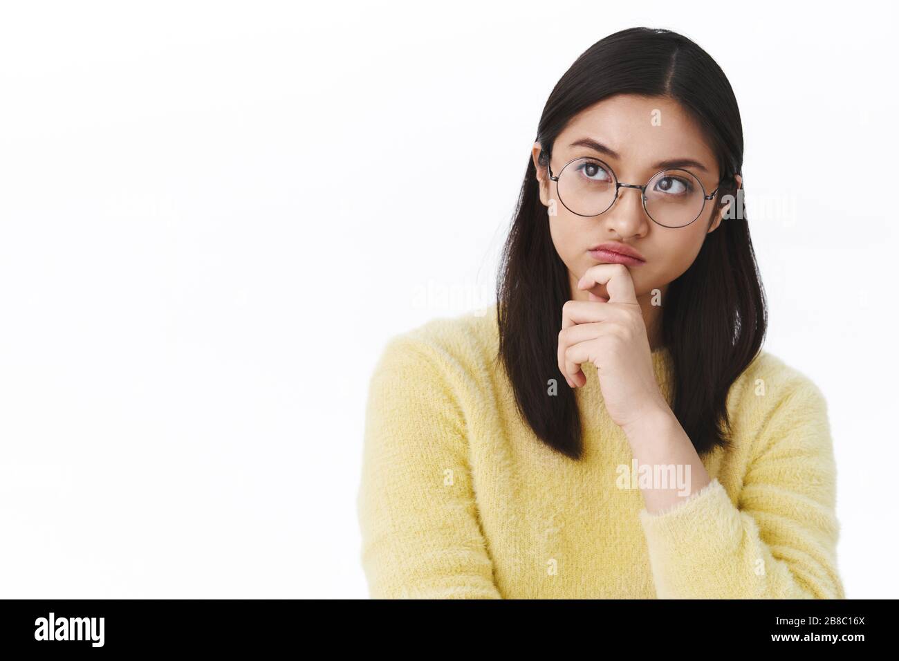 Focused woman thinking. Close-up portrait serious thoughtful asian girl ...