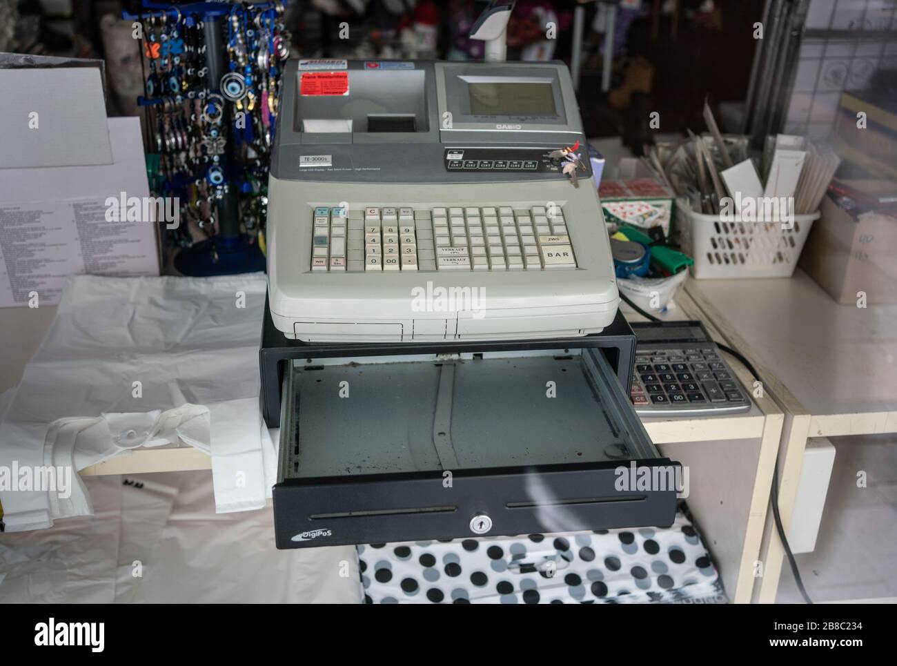 Offenbach, Germany. 21st Mar, 2020. An open, empty cash register is ...