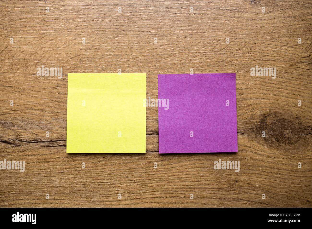 collection of various empty colorful post it paper note on wooden ...