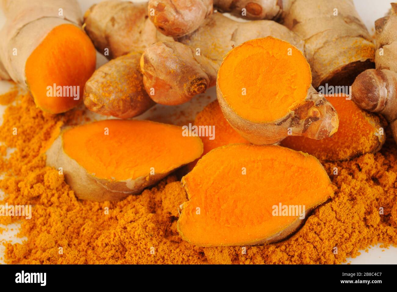 Turmeric root and powder on white background Stock Photo - Alamy