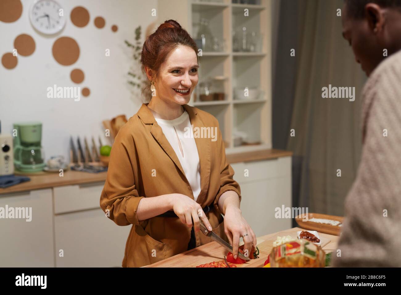 Young man smiling cutting hi-res stock photography and images - Alamy