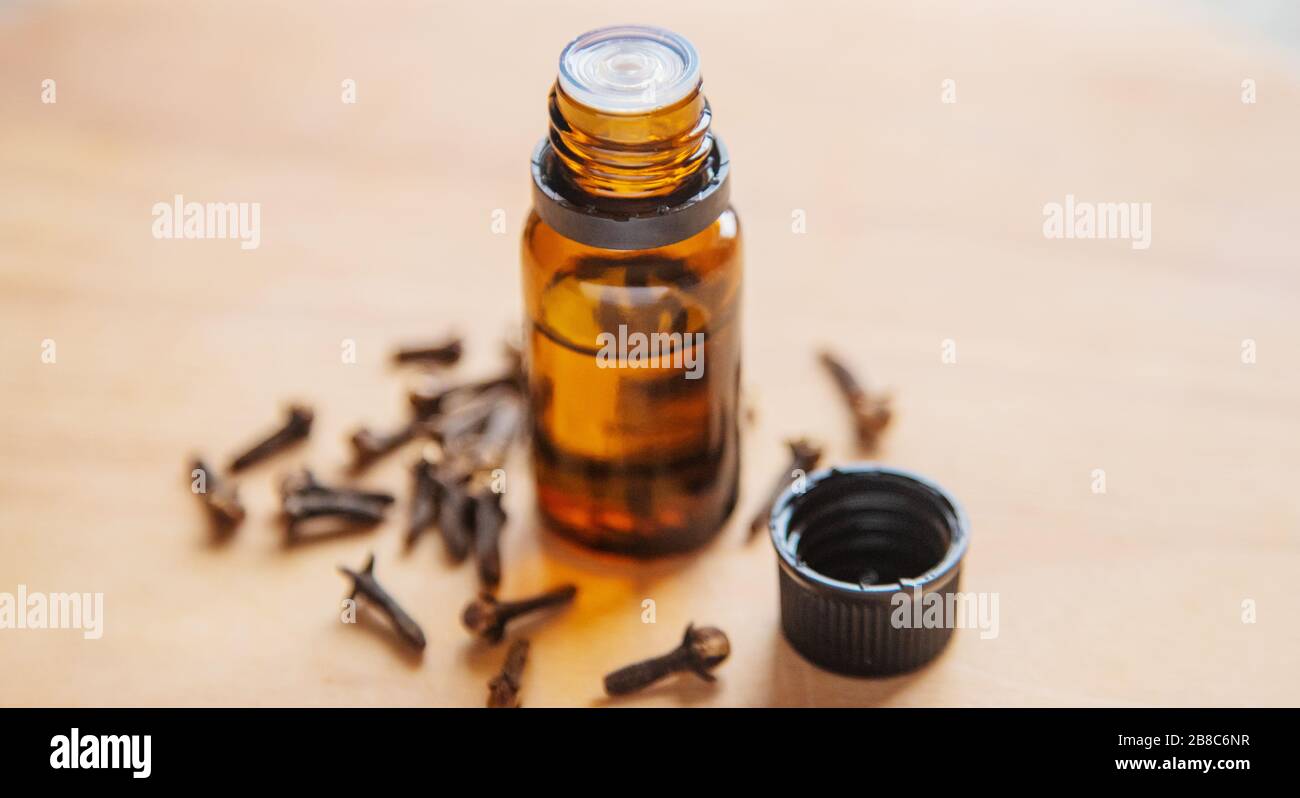 Clove essential oil in a small bottle. Selective focus. nature Stock ...