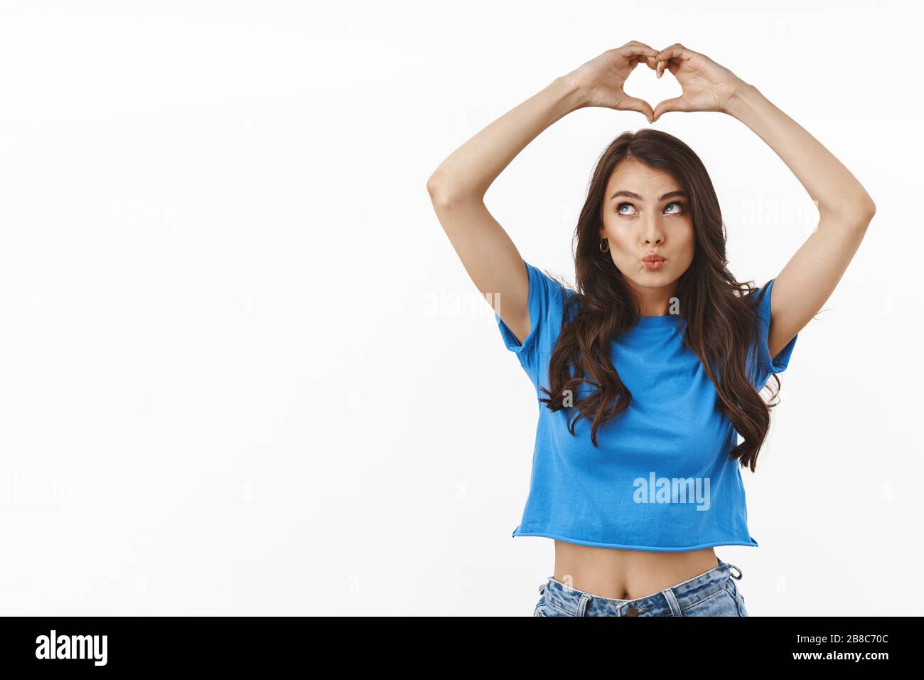 Silly and dreamy cute brunette girl thinking about falling in love ...