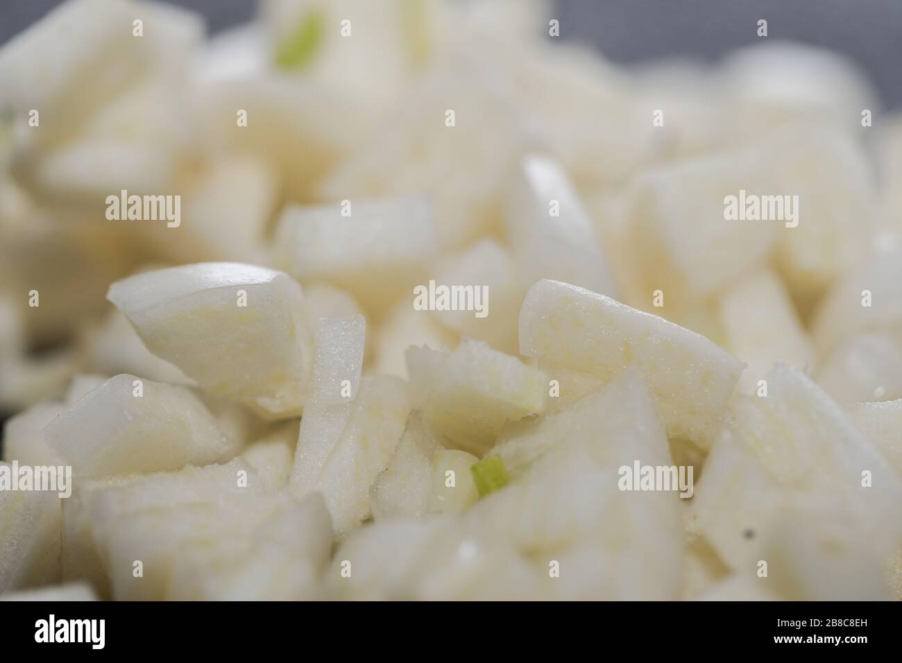 Detail of pile of small cut garlic pieces Stock Photo - Alamy
