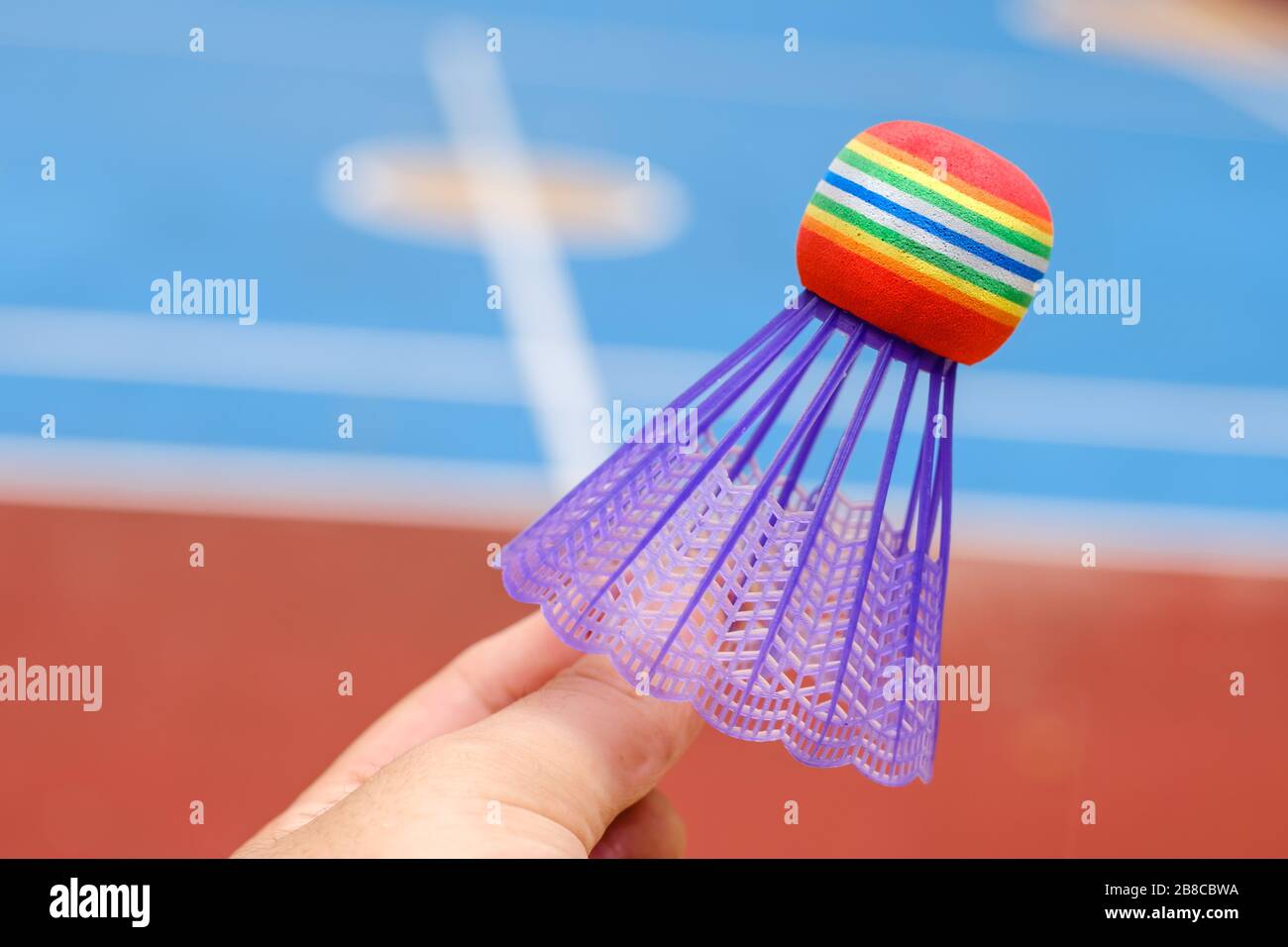 hand hold colorful plastic Badminton in the training ground Stock Photo ...