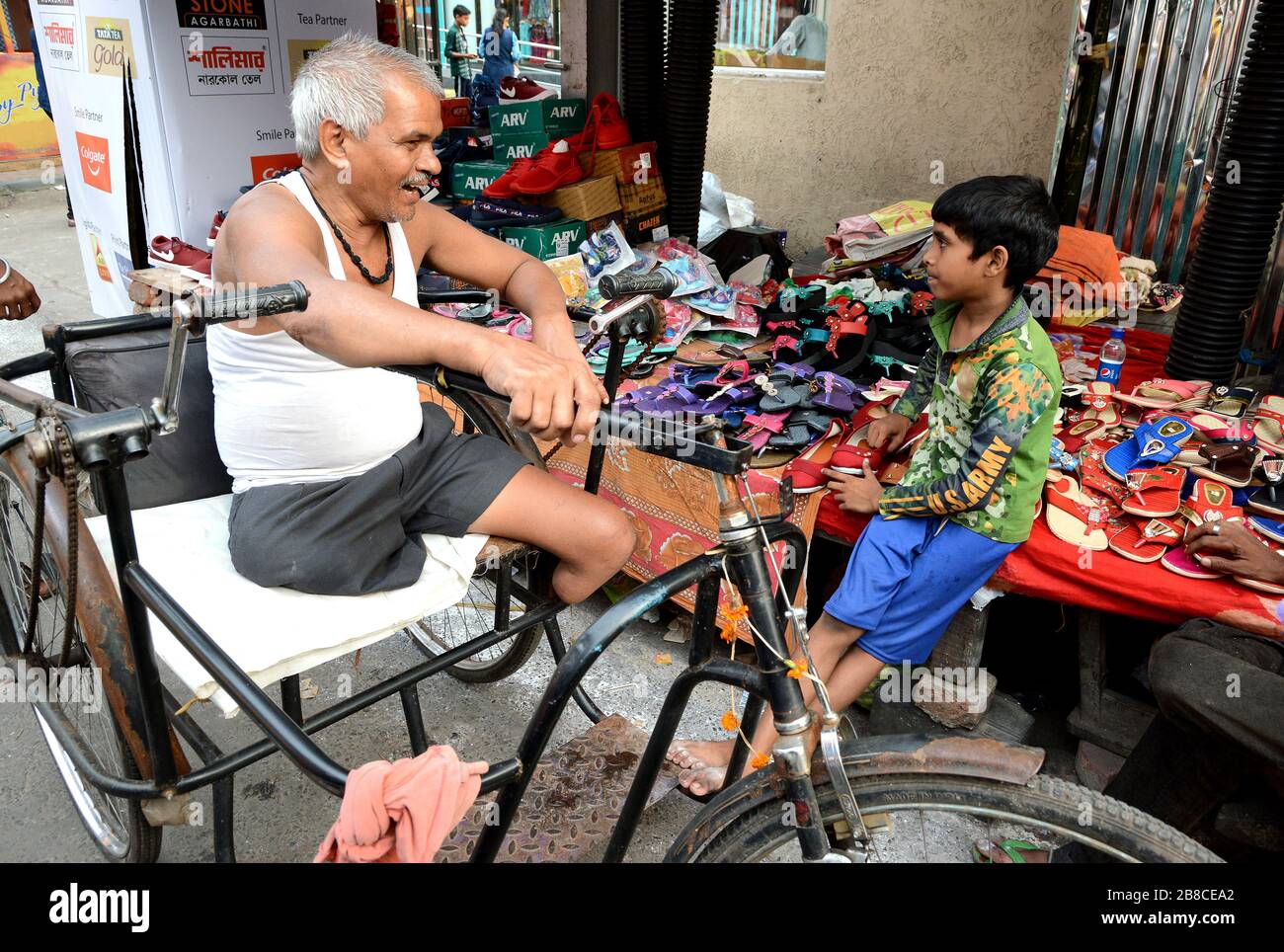 A little shopkeeper gossip to his handicapped grand father in the front ...