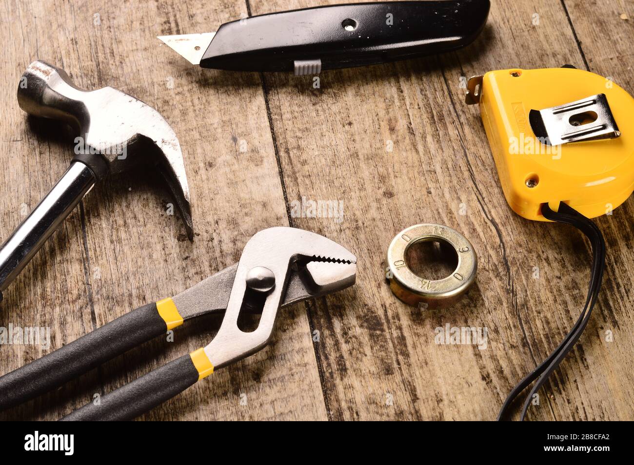Mix of tools on the workshop table Stock Photo - Alamy
