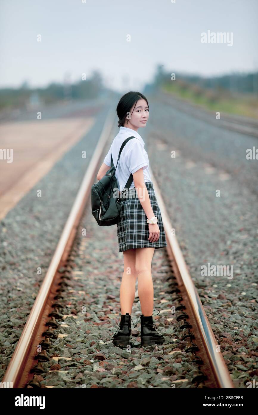 Girl standing on railroad track hi-res stock photography and images - Alamy
