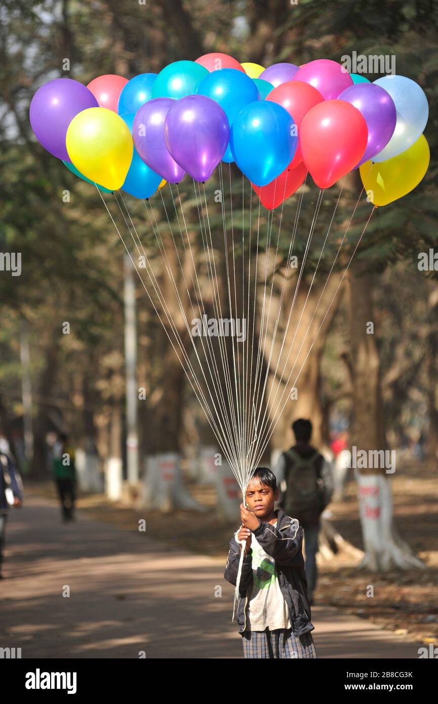 A Bangladeshi young boy, who go through with poverty sales balloons ...