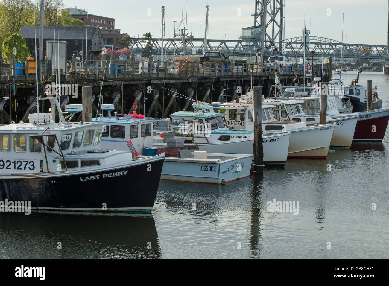 Portsmouth's commercial pier, winds around this harbor. Seasoned ...