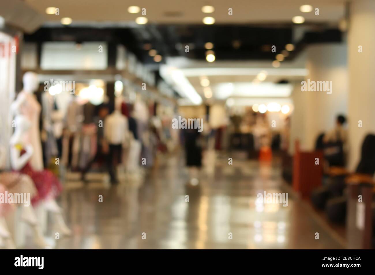 Blurred picture of Clothing store fashion shop inside shopping mall ...