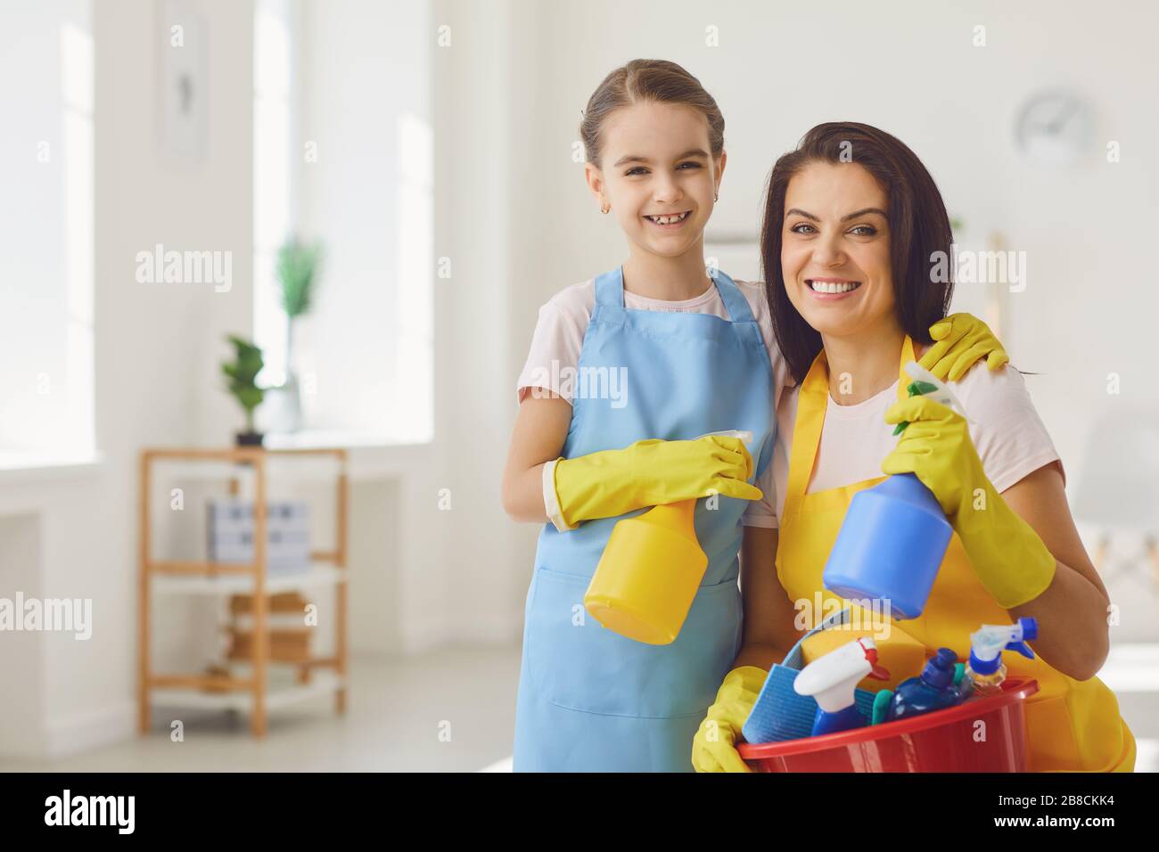Happy smiling family cleans the living room Stock Photo - Alamy