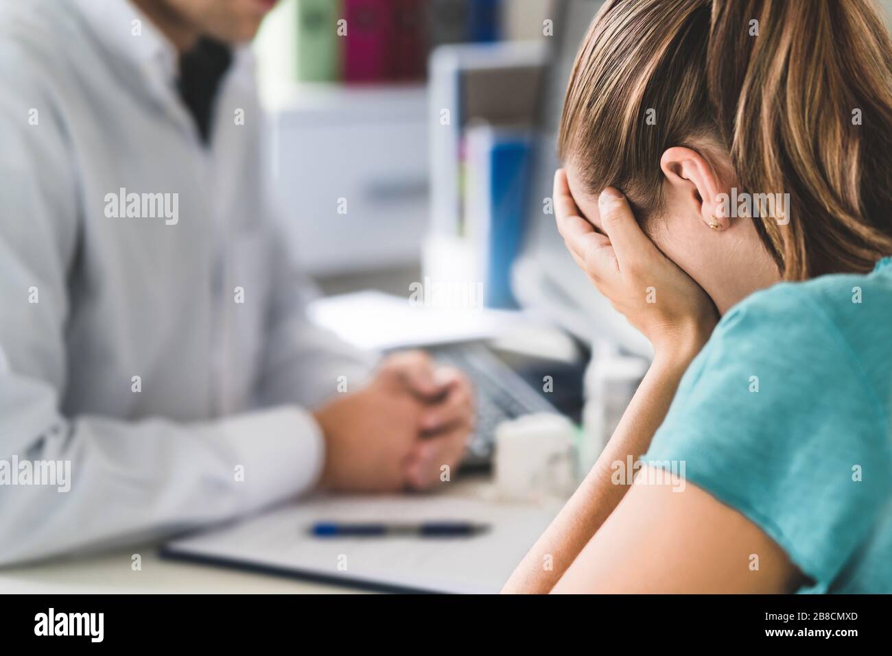 Sad patient visiting doctor. Young woman with stress or burnout getting ...