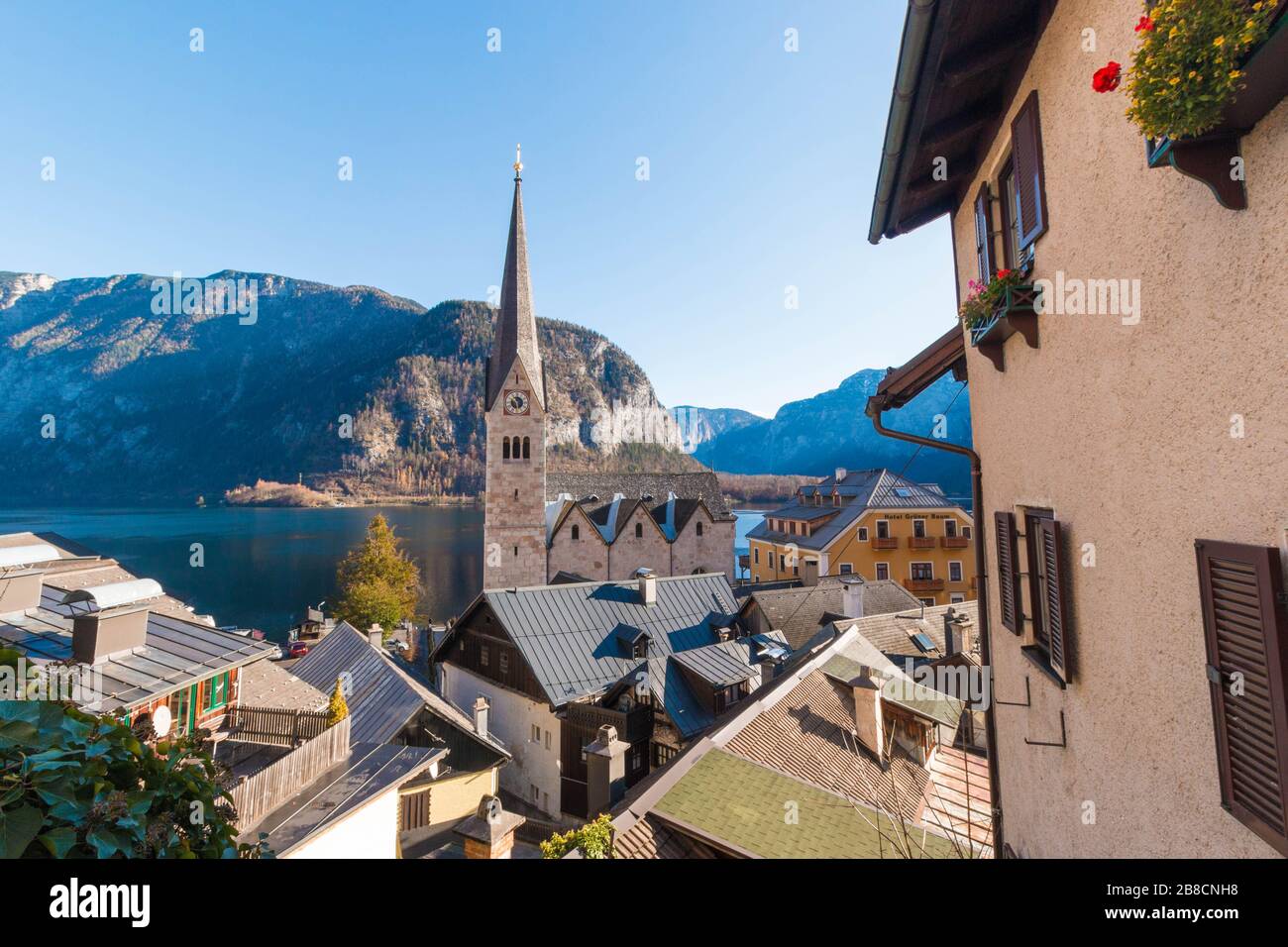 View of famous austrian town Hallstatt, neo-gothic Evangelical church ...