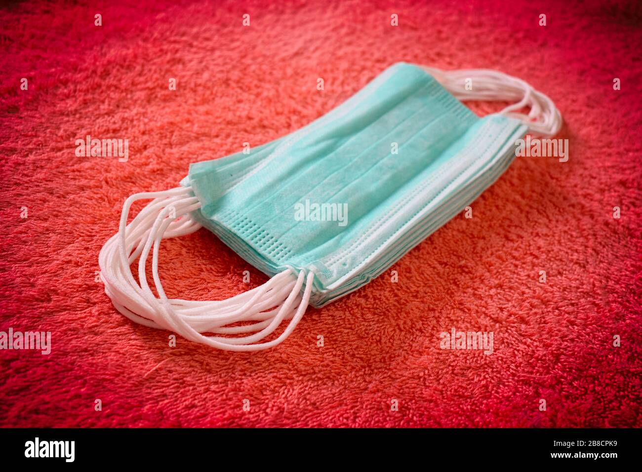 Medical protective face mask on red background, Disposable surgical ...