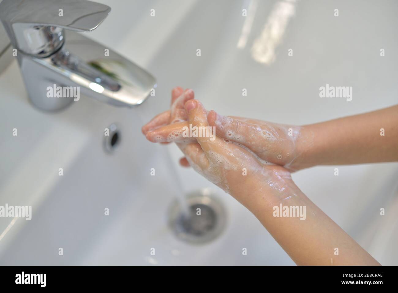Close up of hands washing with soap. Washing hands with soap under the ...