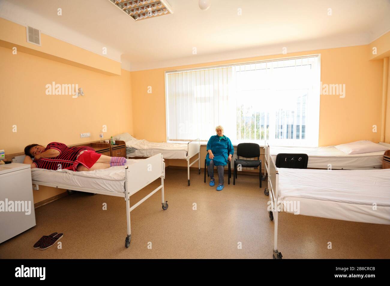 At a hospital room. Women (patients) lying on hospital beds Stock Photo ...
