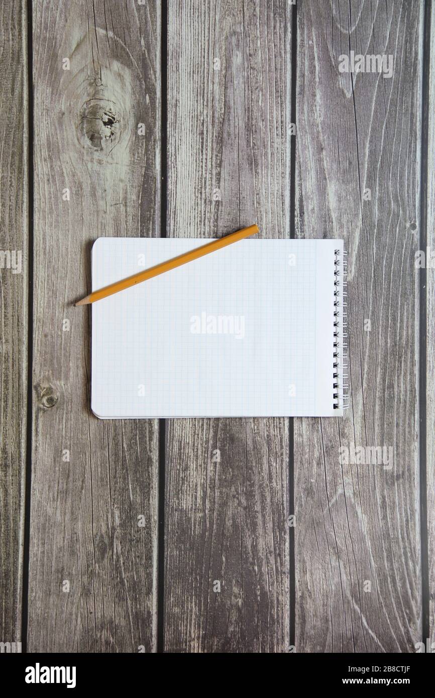 Notepad with a blank white sheet in a checker paper with simple ...