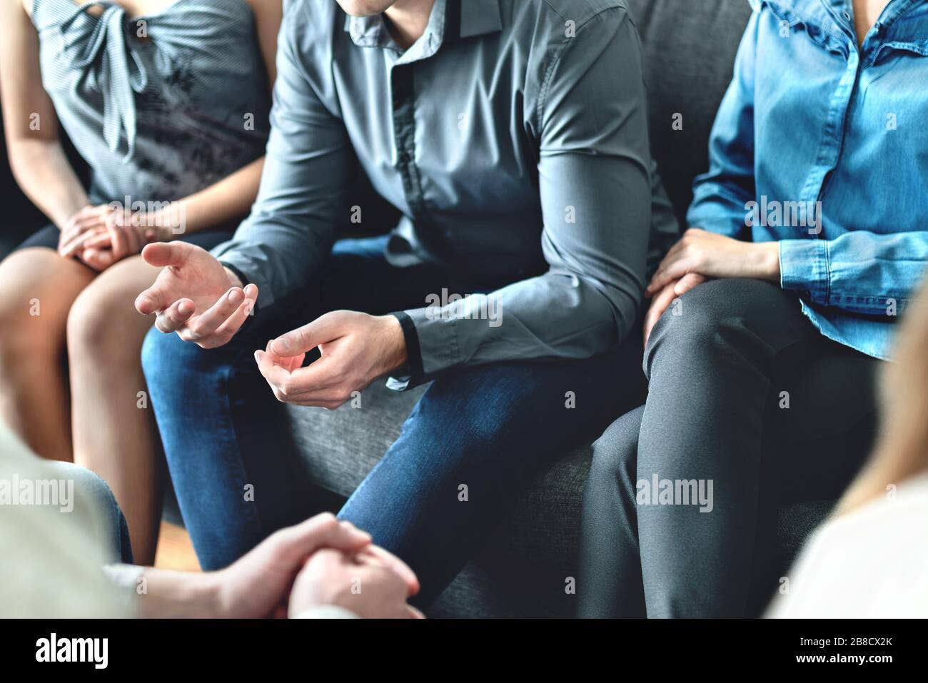 Counseling and conversation in group therapy or meeting. Man sharing ...