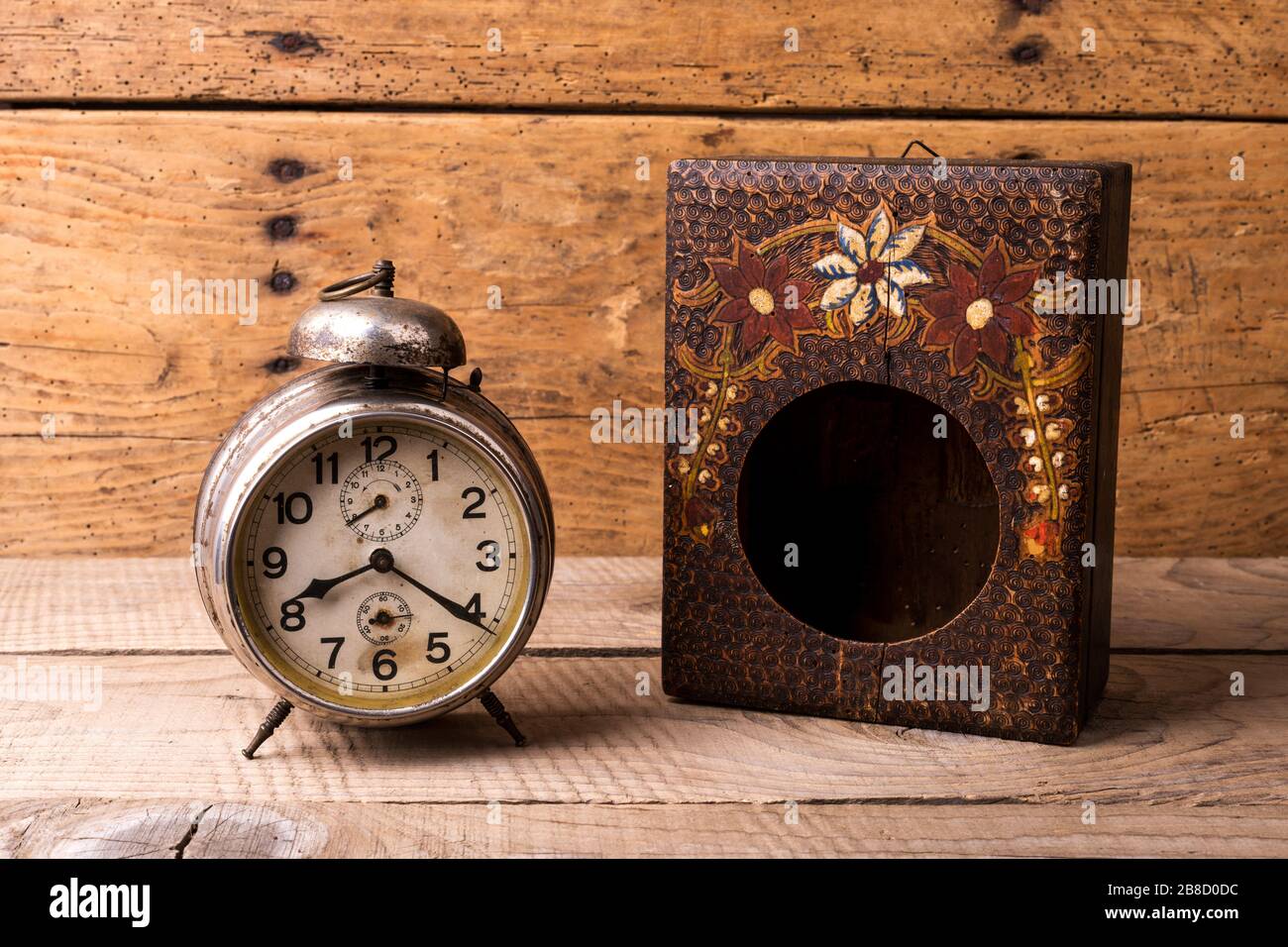 Antique clock with carved wooden box over an old vintage table - copy ...
