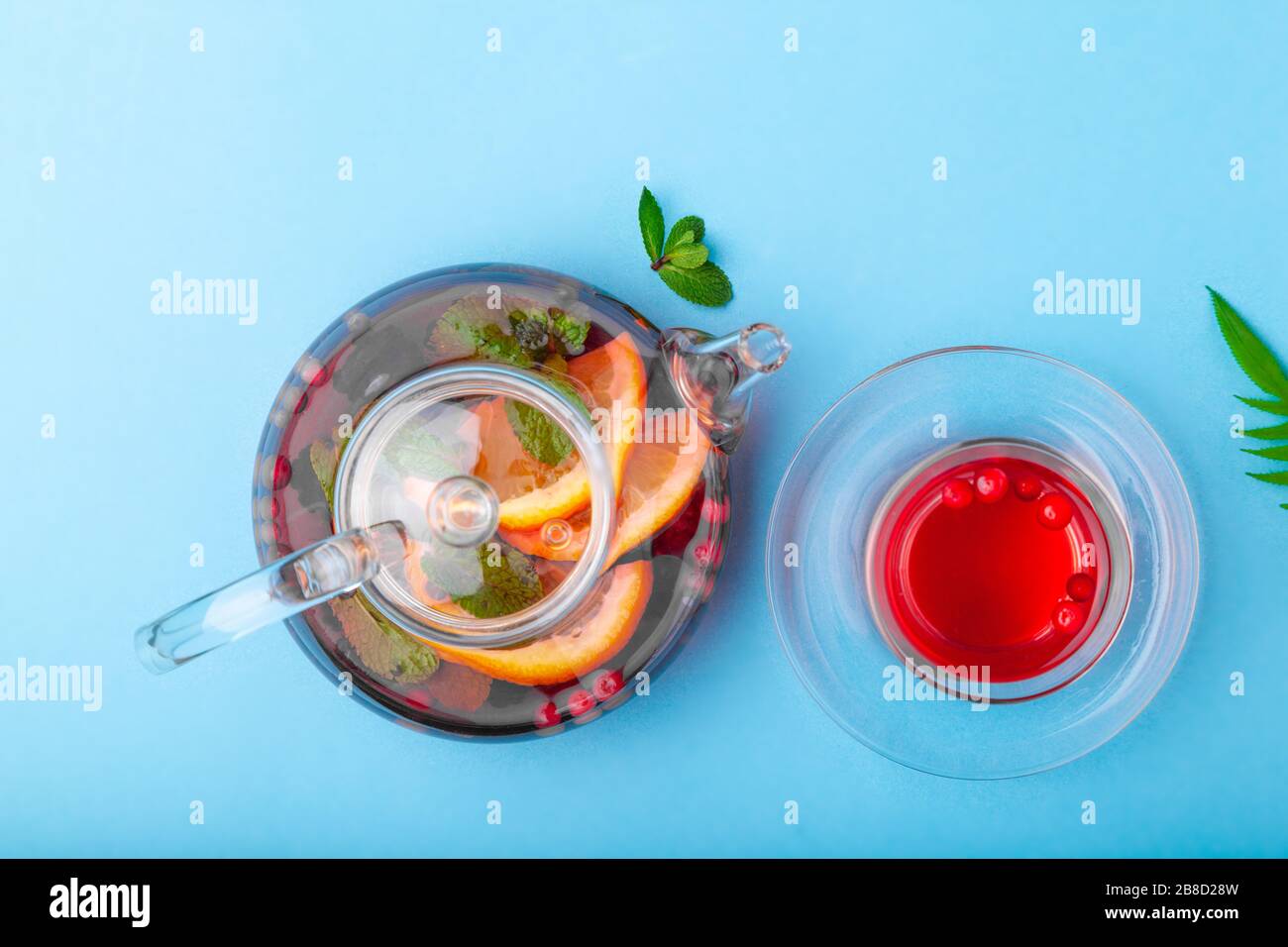 Fruit tea with berries in kettle, turkish shape tea cup Stock Photo - Alamy