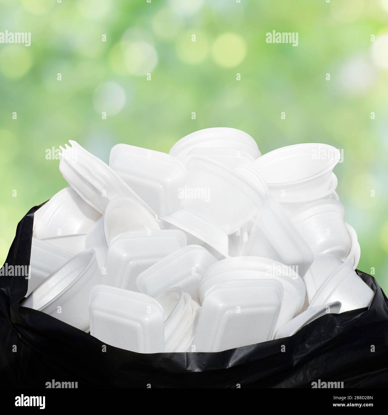 Waste Garbage foam food tray white many pile on the plastic black bag ...