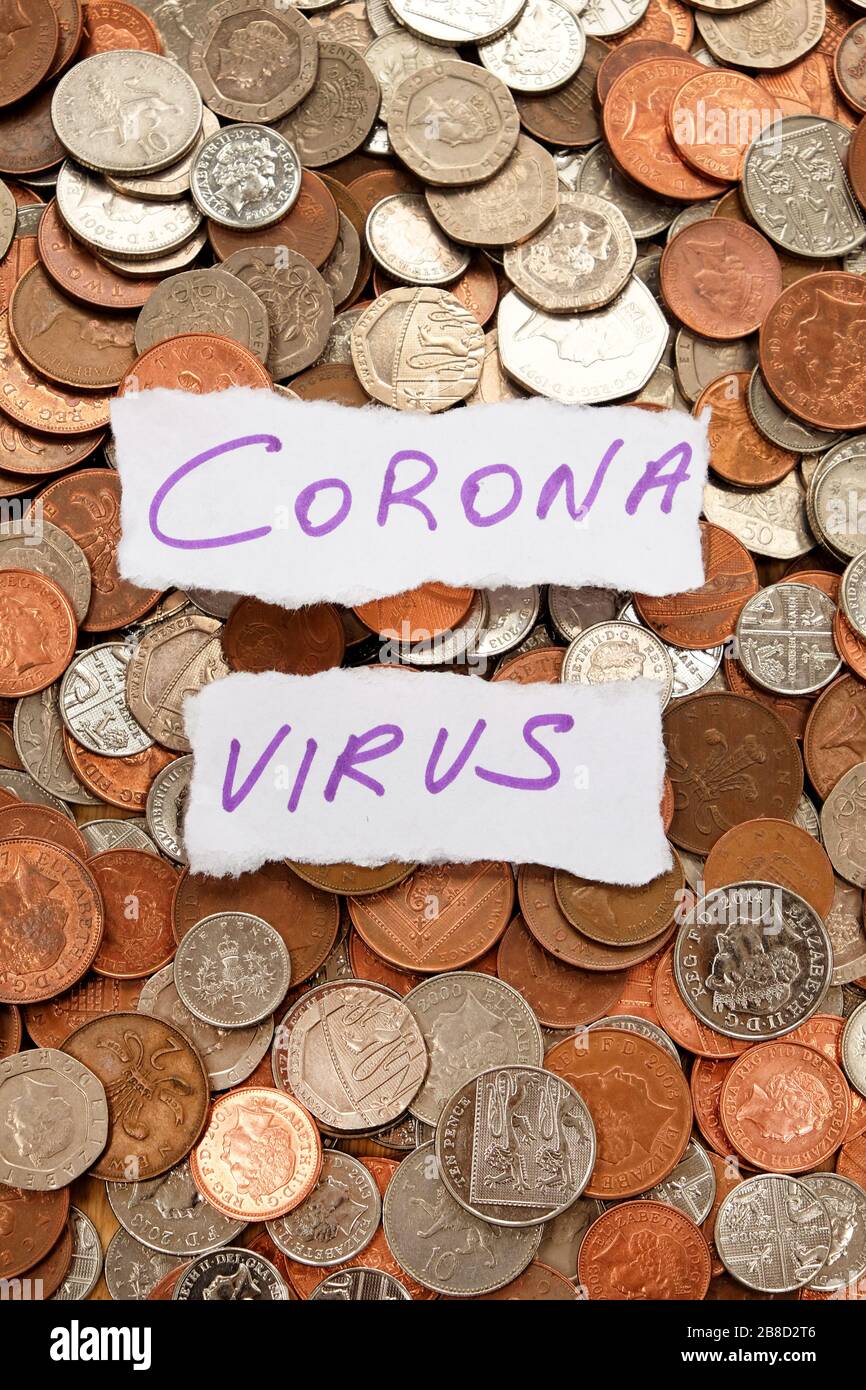 The words corona virus written in purple ink on two pieces of ripped ...