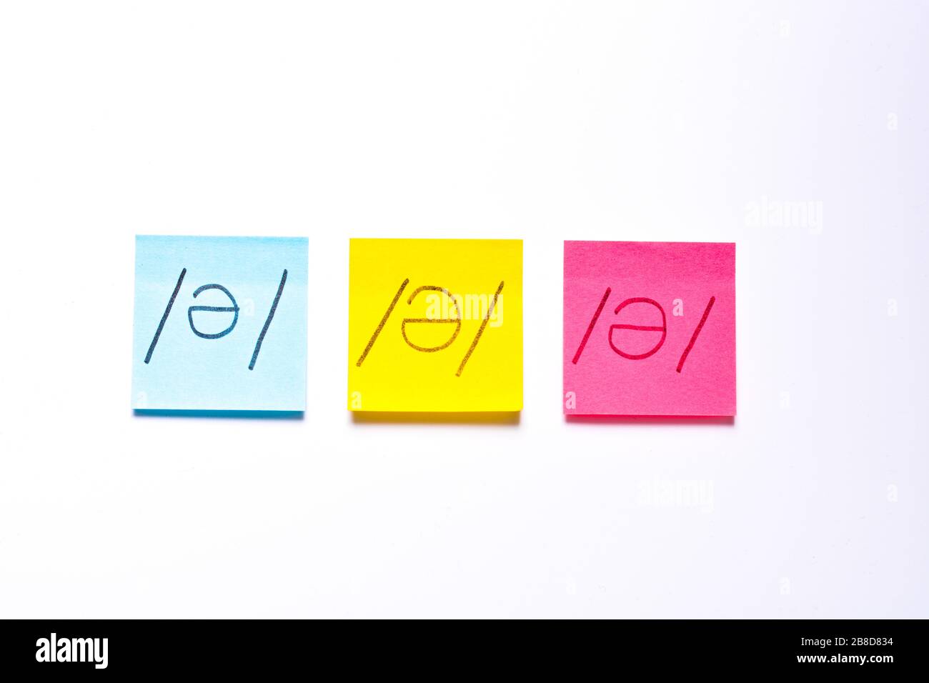 Three post its on white background with a different symbols on it Stock ...