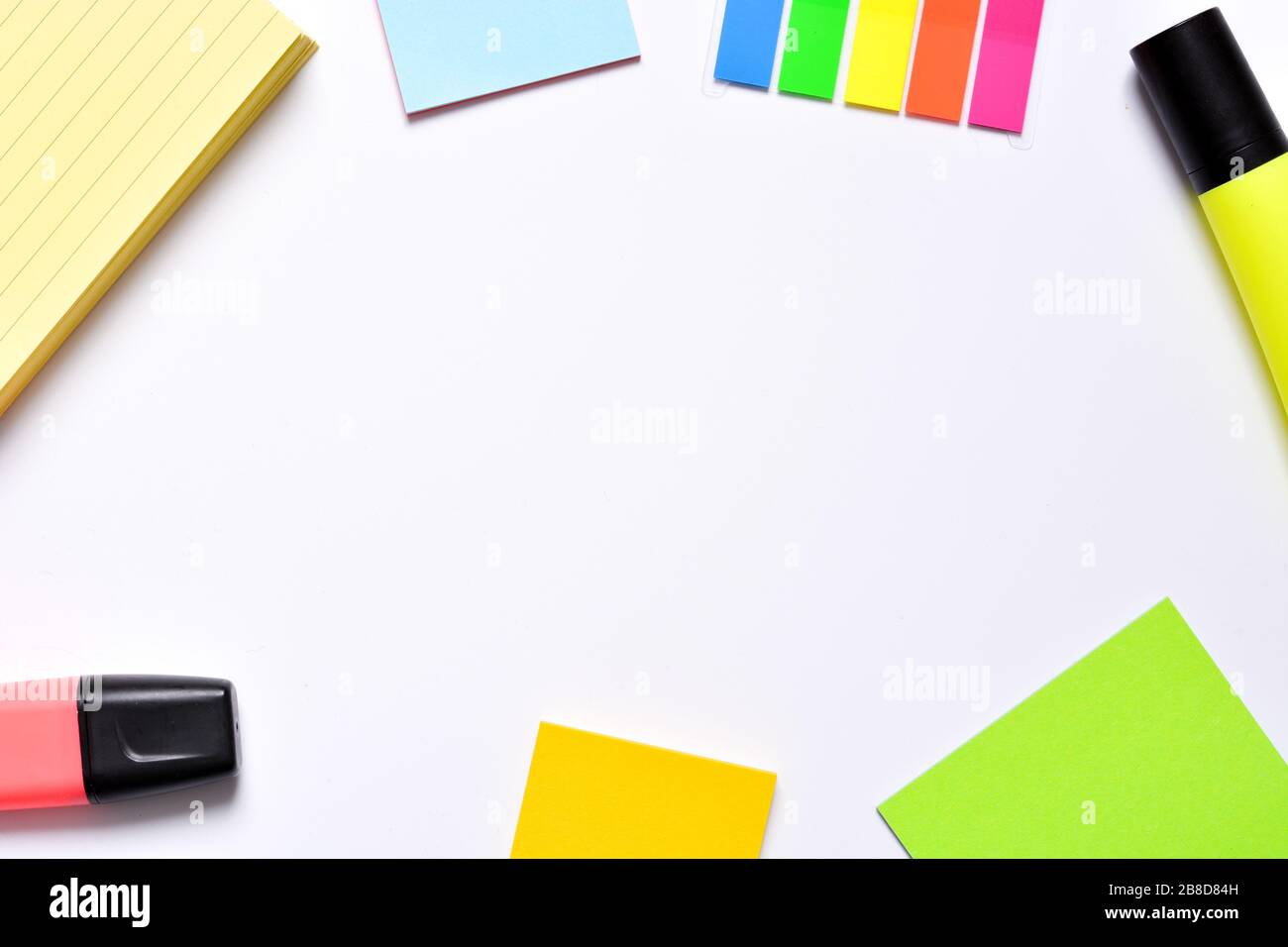 A frame of a desk with post its and a markers on white background Stock ...