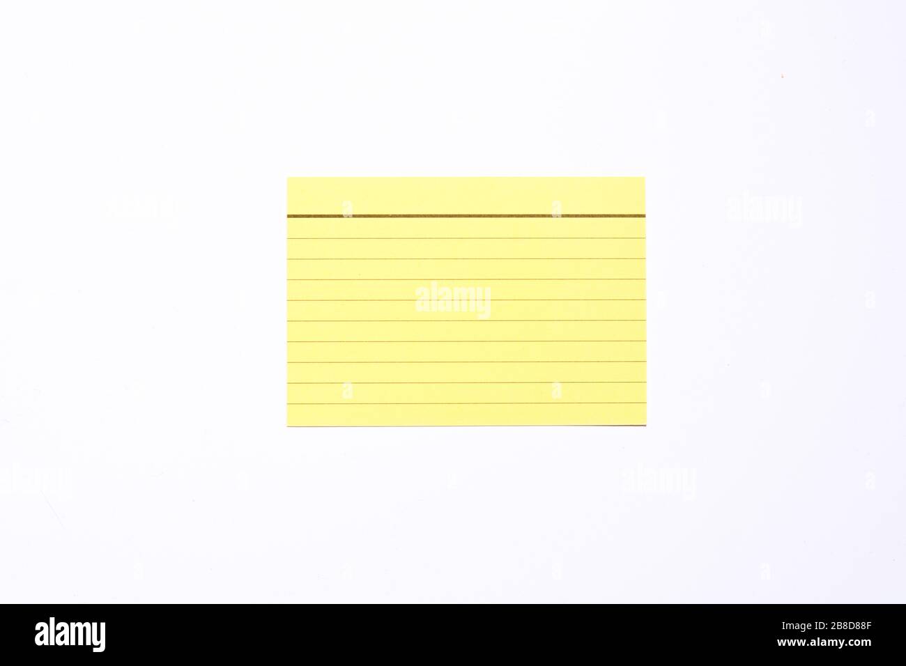 A yellow notes sheet on white background Stock Photo - Alamy