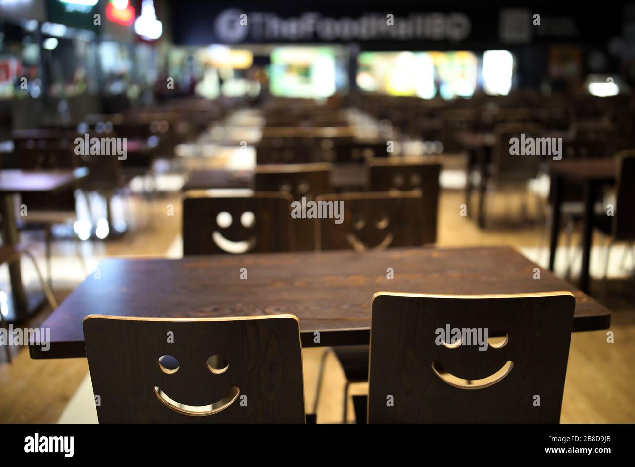 An empty restaurant seats and tables are seen at a shopping mall during ...