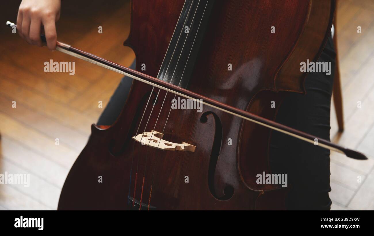 Cello player cellist hands playing hi-res stock photography and images ...