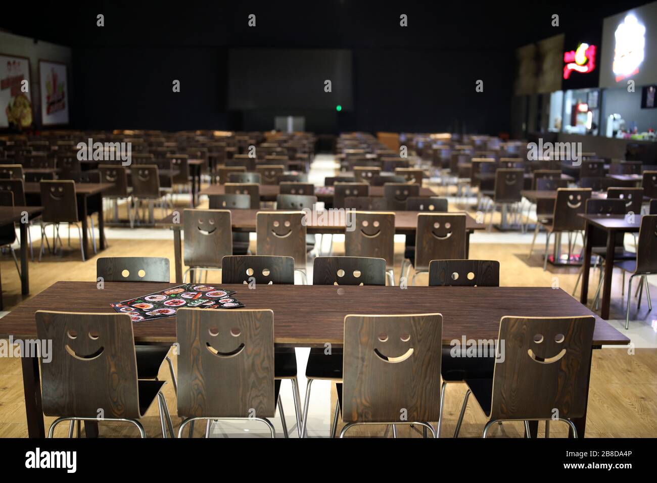 An empty restaurant seats and tables are seen at a shopping mall during ...