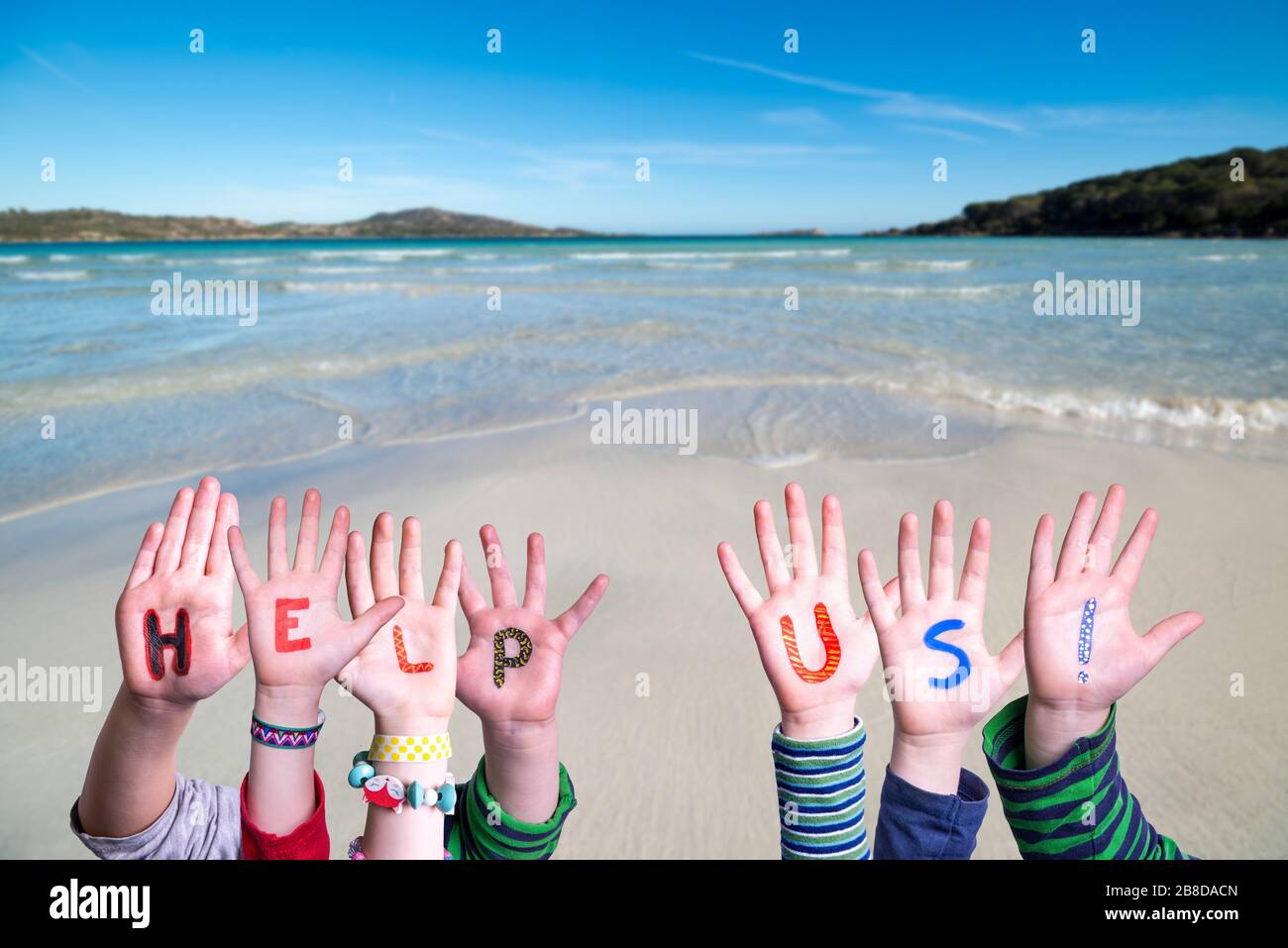 Children Hands Building Word Help Us, Ocean Background Stock Photo - Alamy