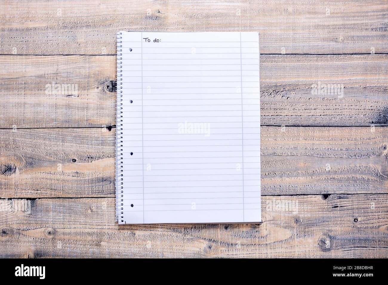 A notepad with a to do list on a wooden background Stock Photo - Alamy