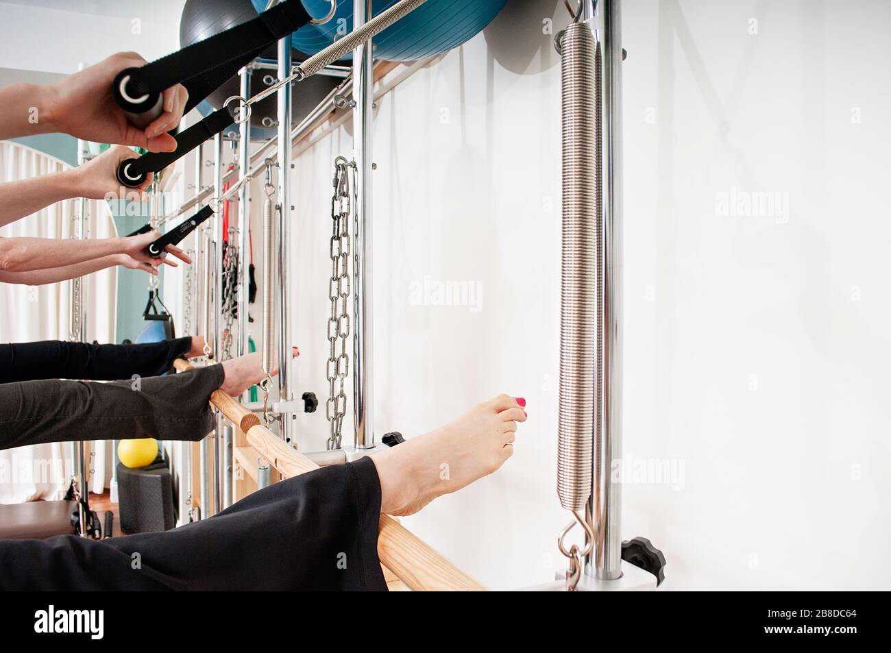 Pilates Barre Class on a Pilates Tower machine Stock Photo - Alamy