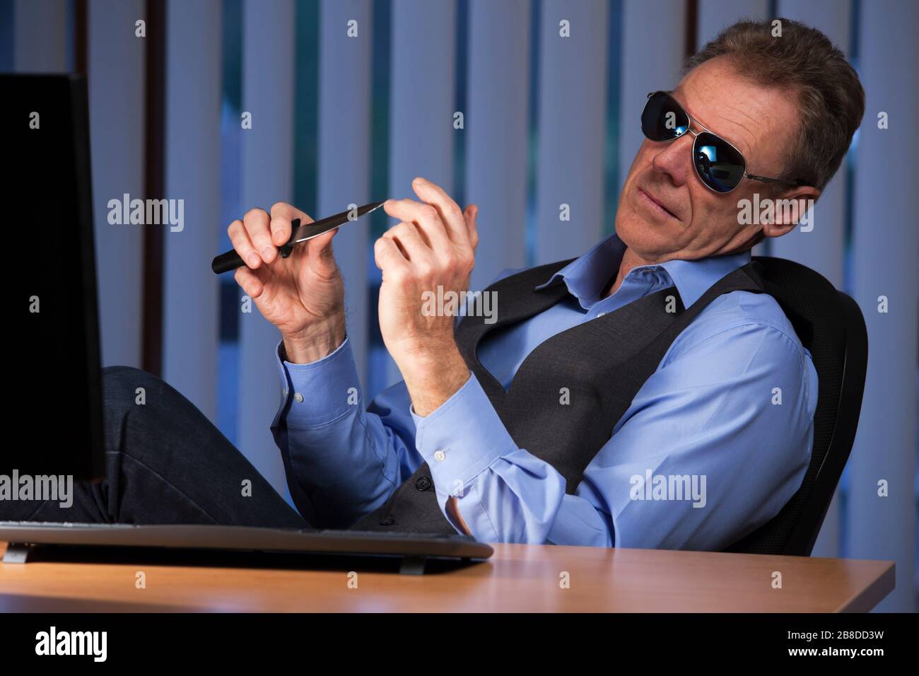 Criminal mafia businessman sitting with knife and reflective sunglasses ...