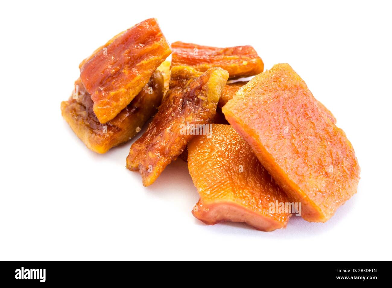 dried papaya pieces on white background Stock Photo - Alamy