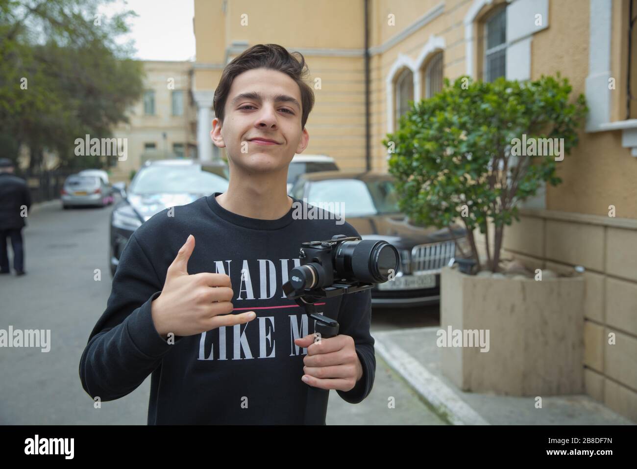 Focus on tripod mounted camera screen showing . Digital equipment ...