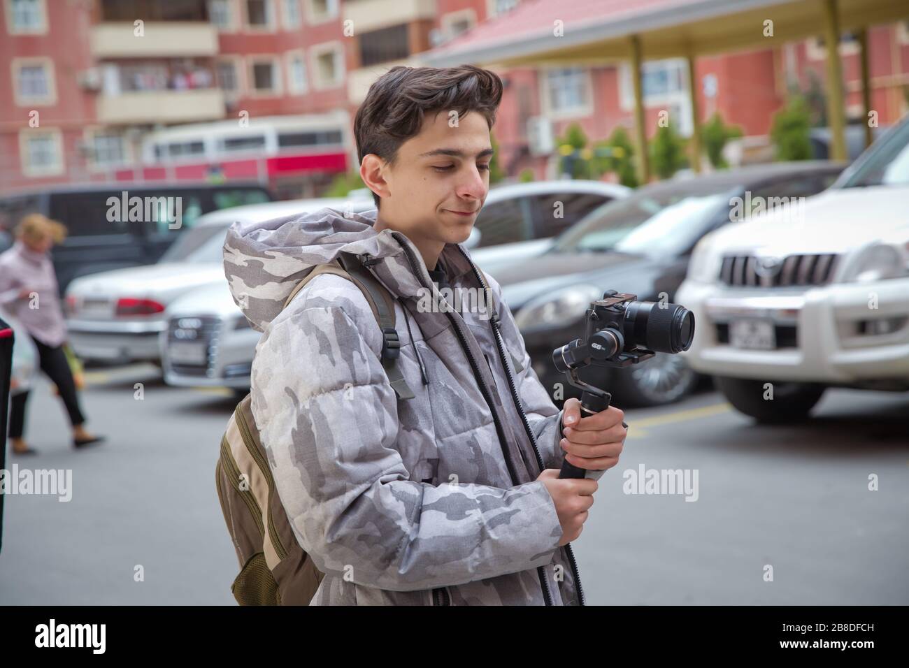 Focus on tripod mounted camera screen showing . Digital equipment ...