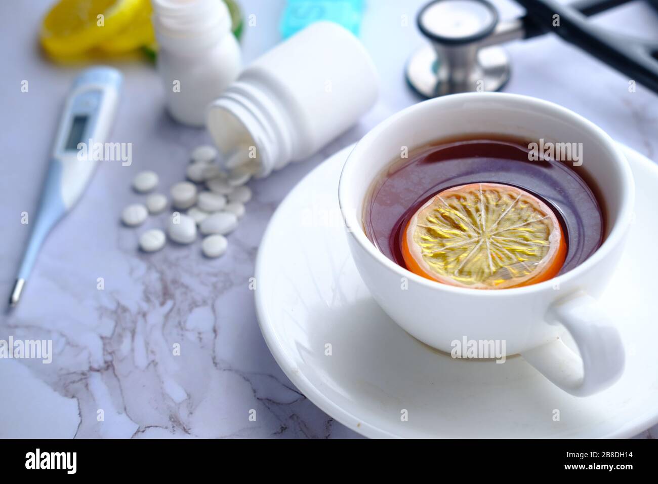 Close up of lemon tea and slice of lemon on yellow background Stock ...