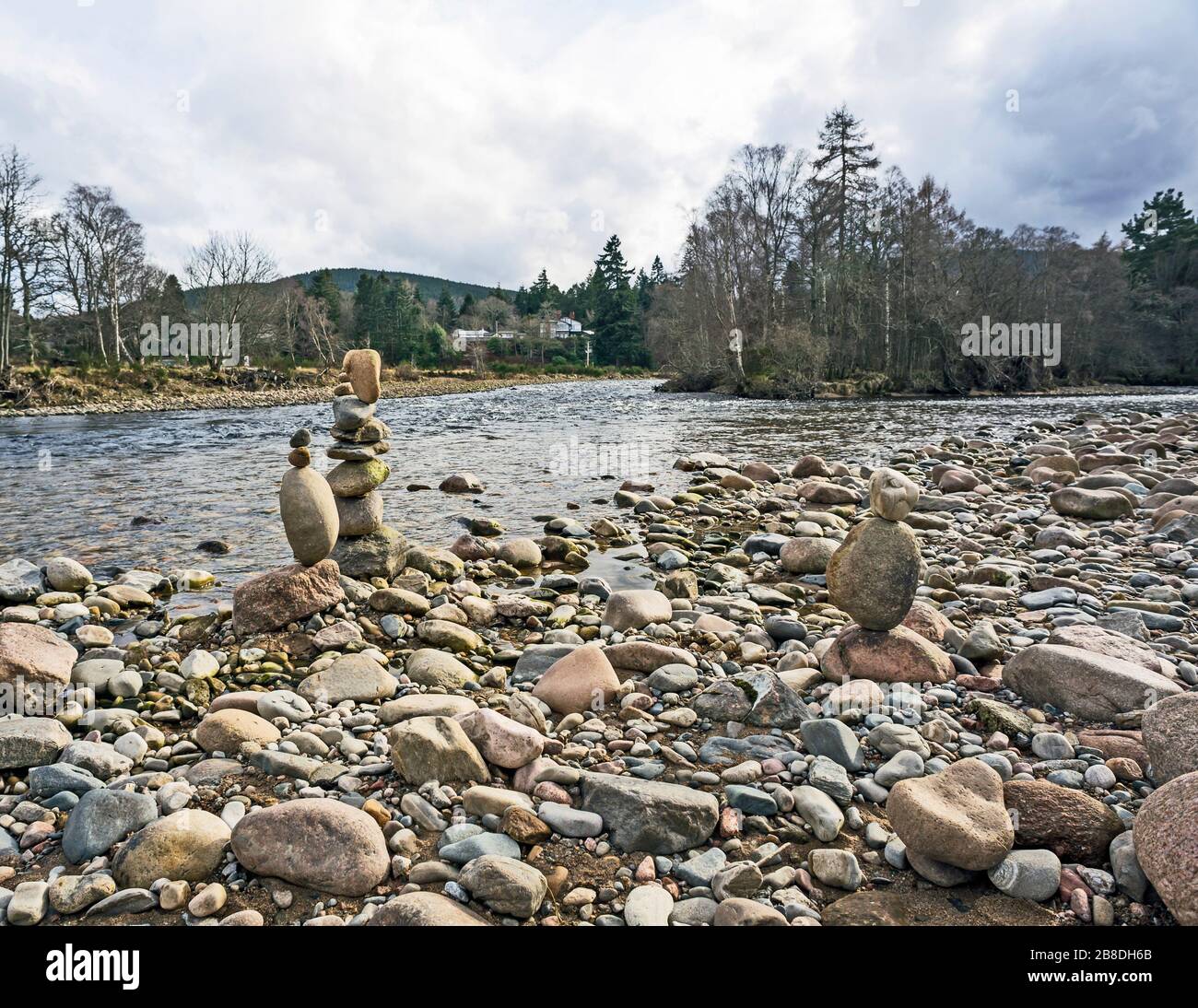 Views of the River Dee at Aboyne, Scotland, UK with stone piles built ...