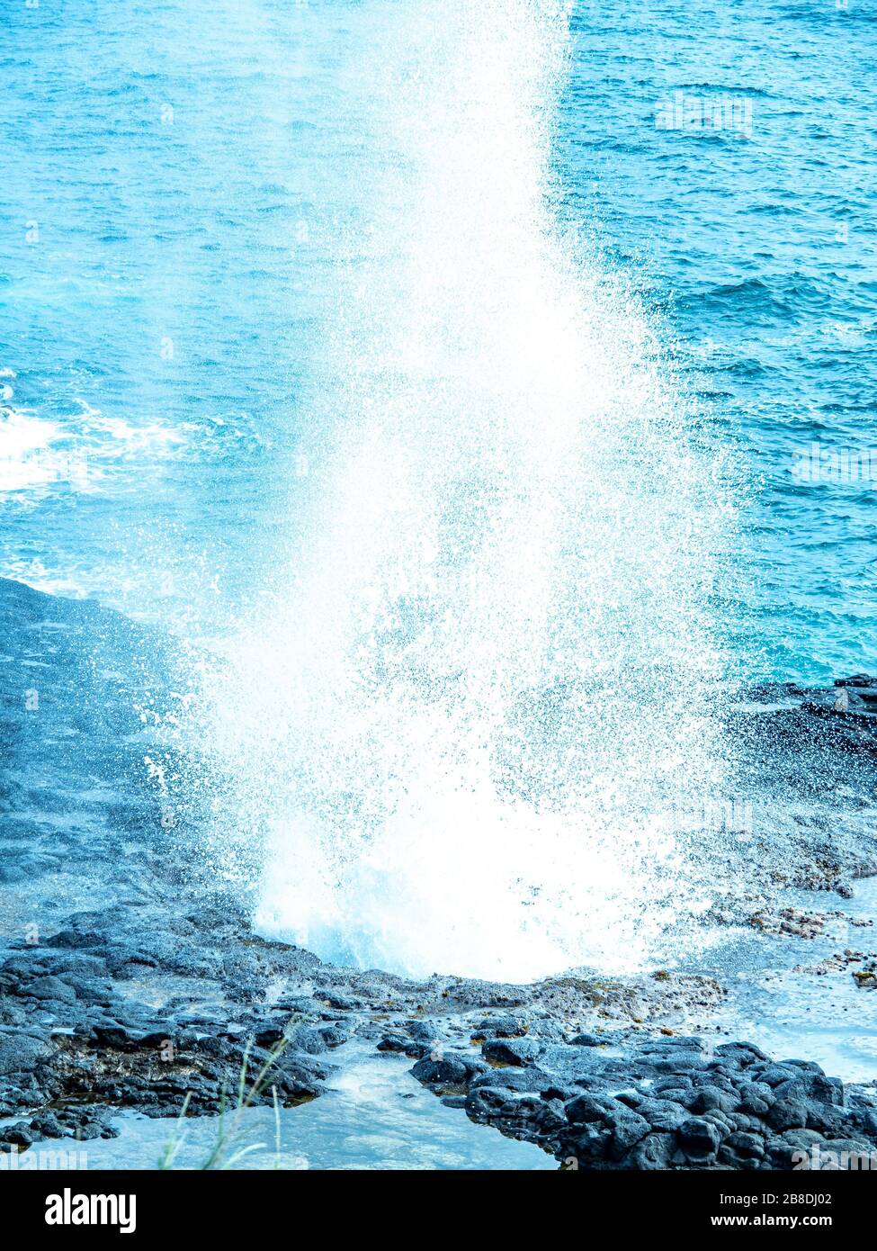 Lava blowholes in Hawaii. The ocean erodes the lava shelf underwater ...
