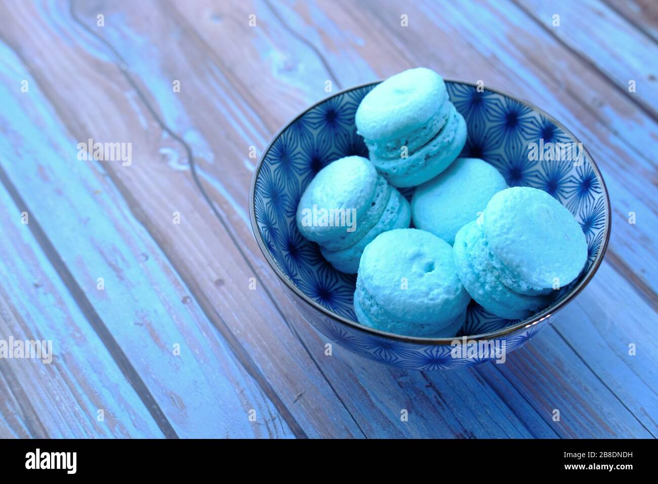Close up of blue color macaroon in a bowl Stock Photo - Alamy