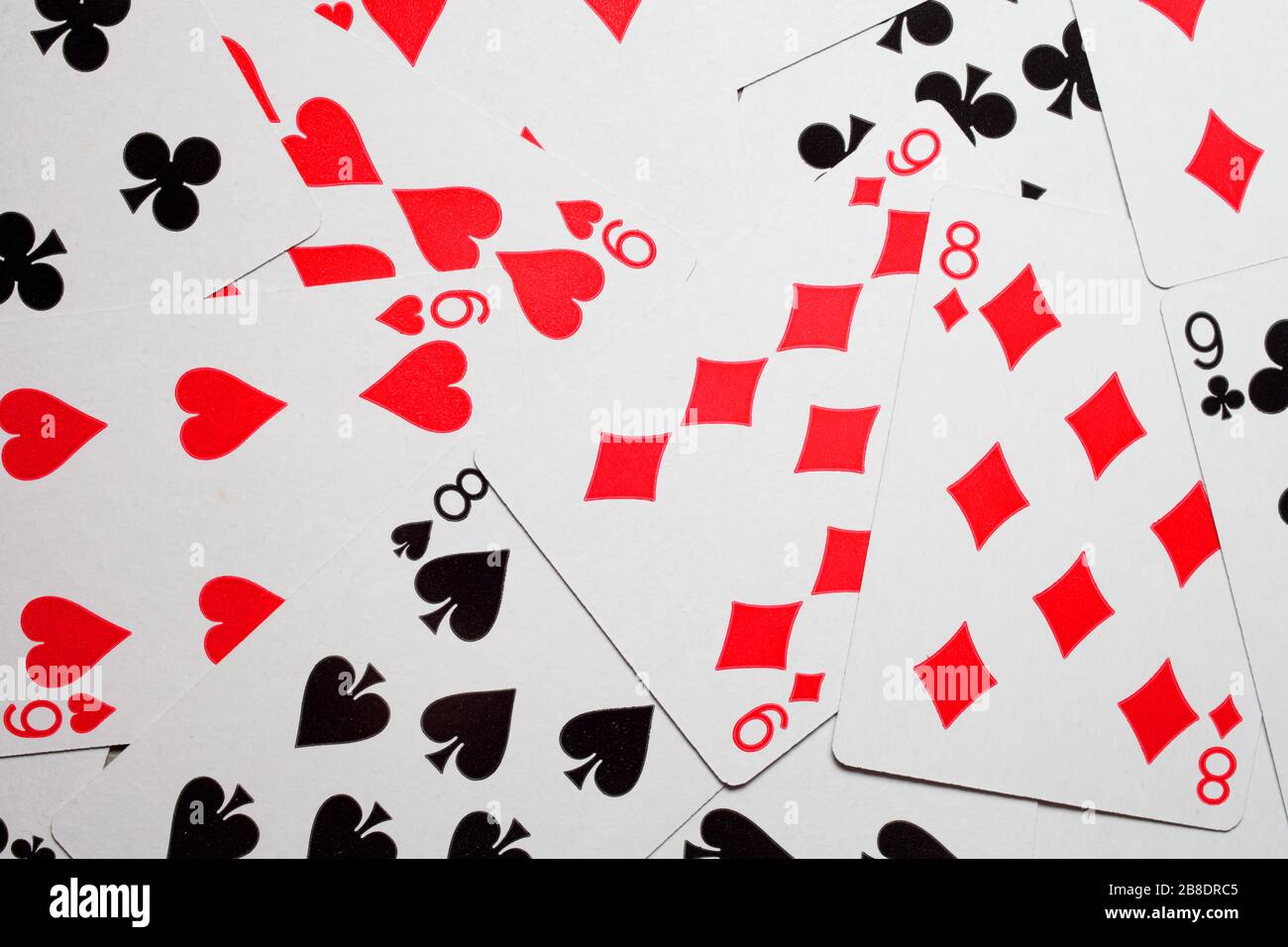 playing cards scattered on the table texture background Stock Photo - Alamy