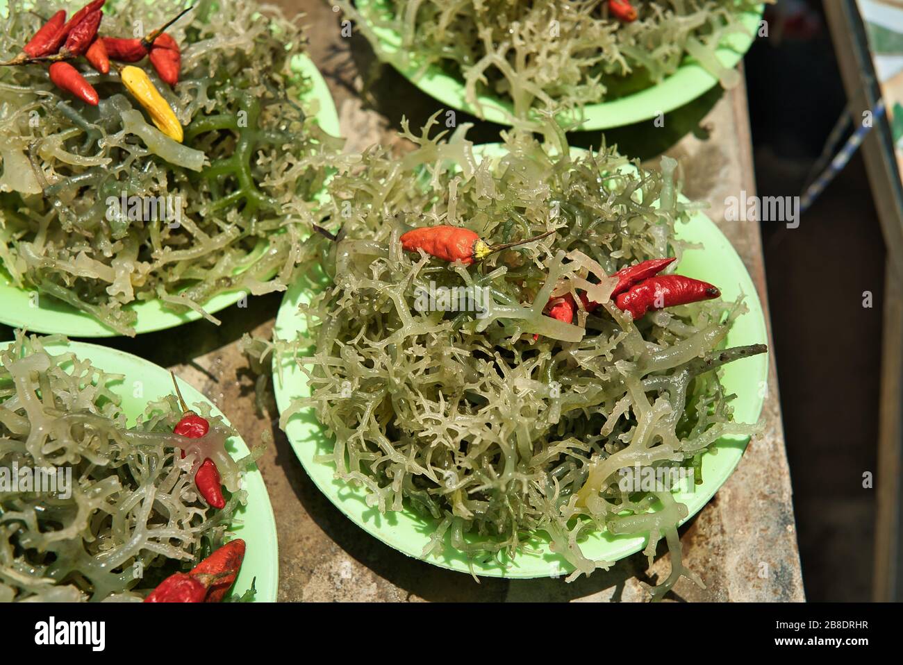 Seaweed dishes with red chilli peppers Stock Photo - Alamy