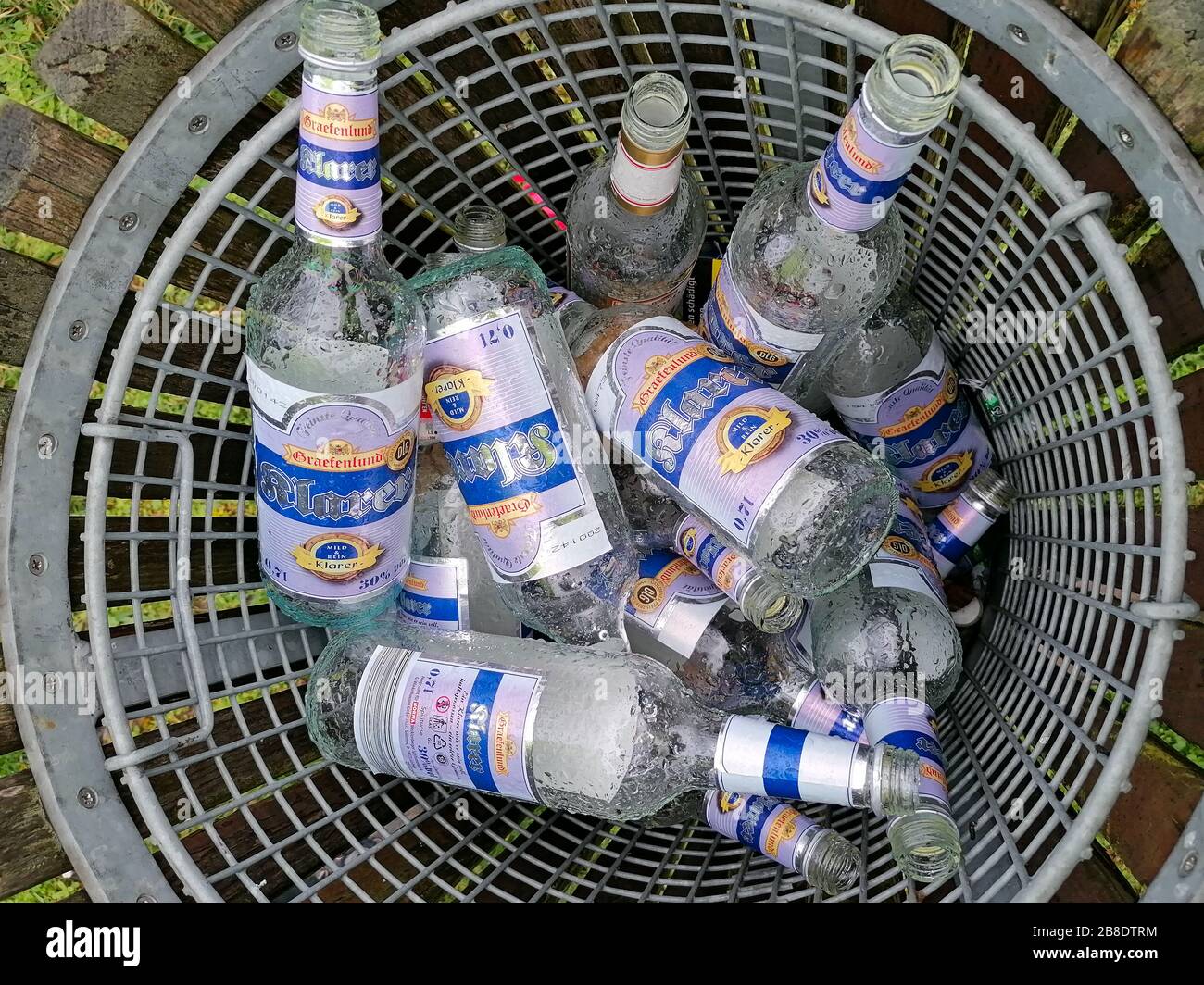 Empty liquor bottles in a waste paper basket at a truck rest area on ...
