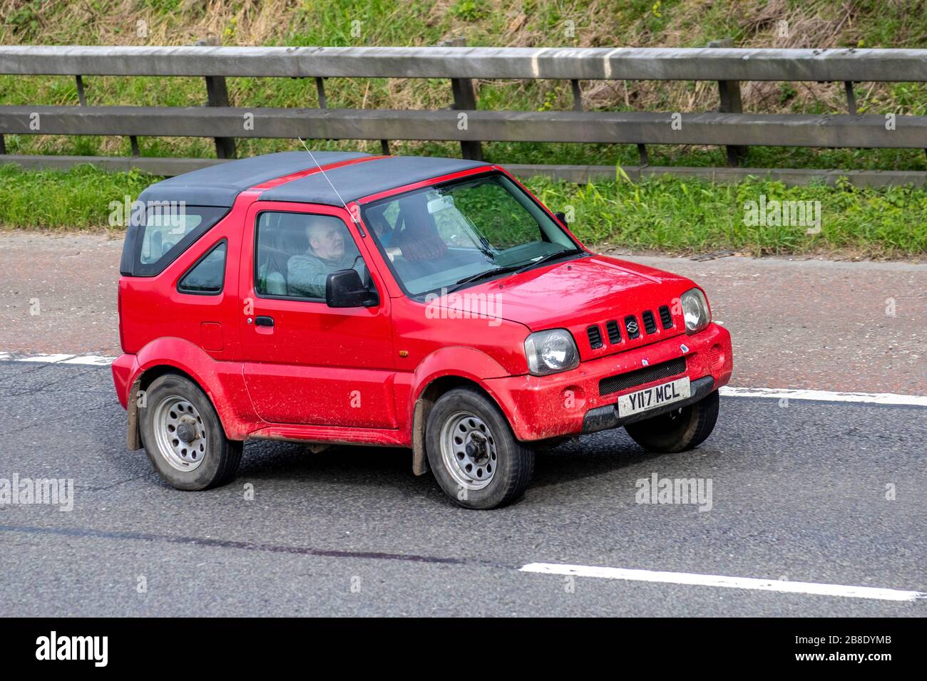 2001 red Suzuki Jimny JLX; UK vehicular traffic, transport, moving ...