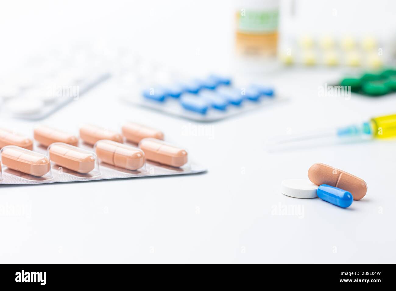 Medicine concept picture assorted medical drugs and syringe on white ...